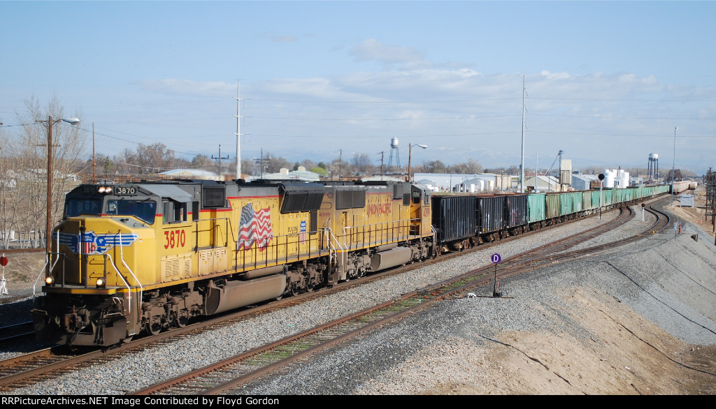 UP 3870 leads east bound ballast train